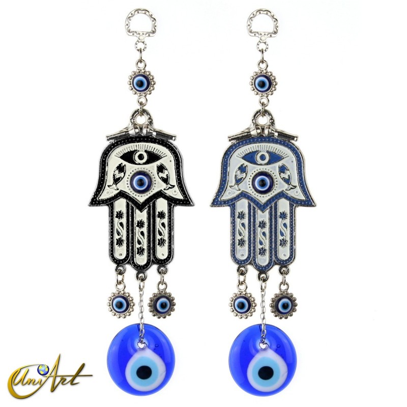 Turkish evil eye and hand of Fatima with ethnic drawings.