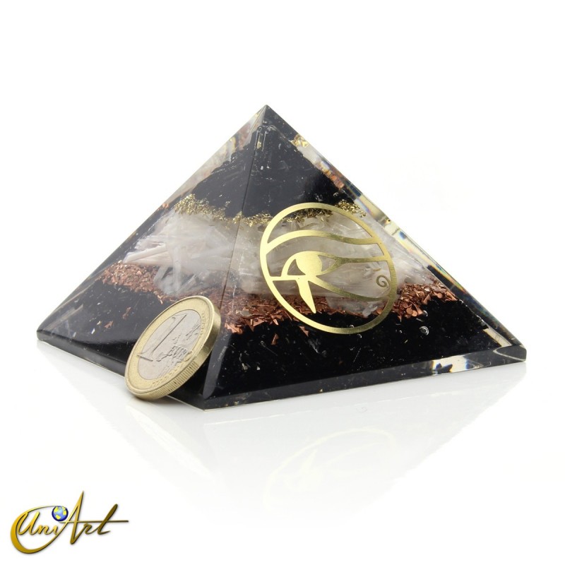 Orgonite pyramid with black tourmaline, selenite, and metal shavings.